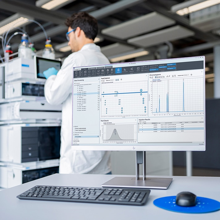 A PC screen displays the OpenLab CDS software. On the left of the ...