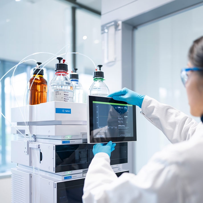 A benchtop 1260 Infinity III LC System. On top of the HPLC System are ...