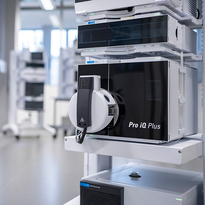 A lab scene with three stacks of small, cuboid shaped analytical ...