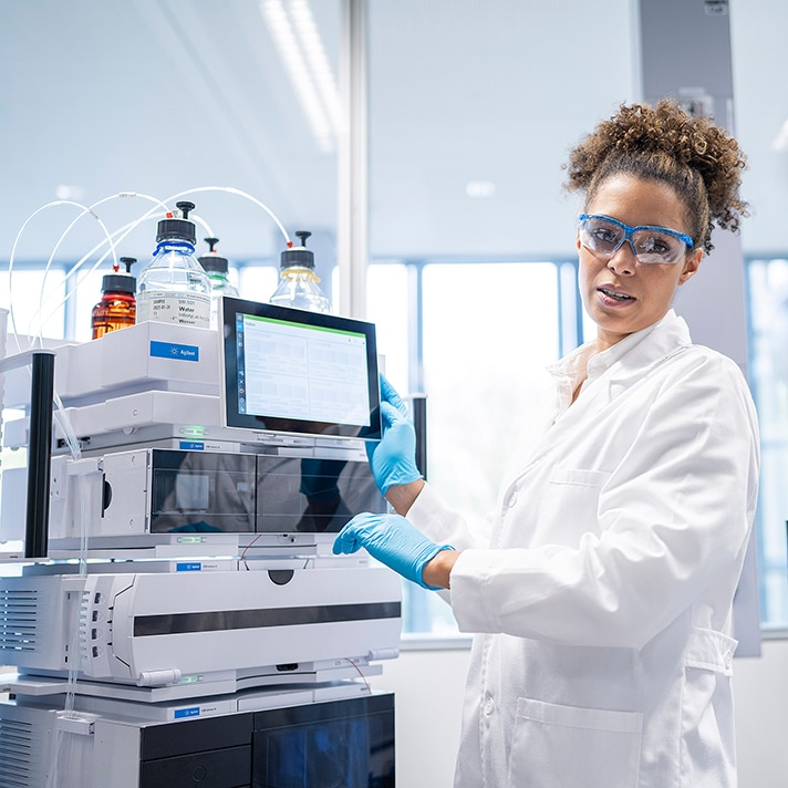 A Laboratory Manager is explaining to their trainee how to use the 1290 ...